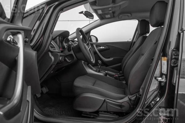Black Opel Astra 2014 in Riga, with an engine capacity of 1.40 L and mileage of 218 thousand km for 3990 €, photo 8 on AUTOMOTO.COM.LV