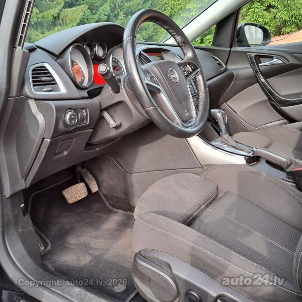 Black Opel Astra 2015 in Tallinn, with an engine capacity of 2.00 L and mileage of 395 thousand km for 3500 €, photo 7 on AUTOMOTO.COM.LV