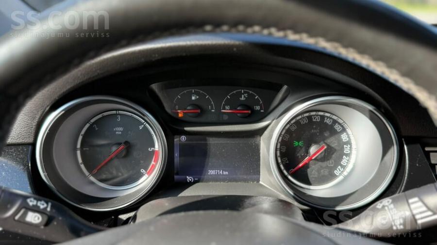Black Opel Astra 2016 in Riga, with an engine capacity of 1.60 L and mileage of 199 thousand km for 8700 €, photo 11 on AUTOMOTO.COM.LV