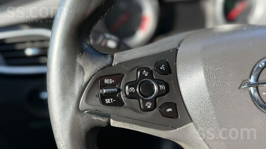 Black Opel Astra 2016 in Riga, with an engine capacity of 1.60 L and mileage of 199 thousand km for 8700 €, photo 12 on AUTOMOTO.COM.LV