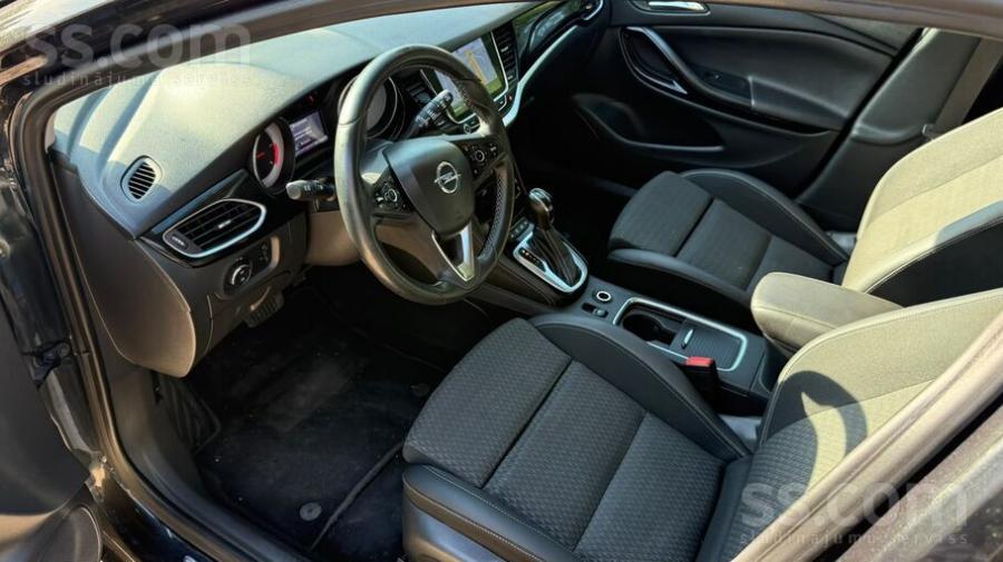 Black Opel Astra 2016 in Riga, with an engine capacity of 1.60 L and mileage of 199 thousand km for 8700 €, photo 14 on AUTOMOTO.COM.LV