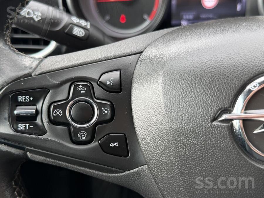 Black Opel Astra 2016 in Riga, with an engine capacity of 1.60 L and mileage of 199 thousand km for 8300 €, photo 17 on AUTOMOTO.COM.LV