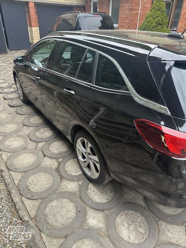 Black Opel Astra 2017 in Panevezys, with an engine capacity of 1.60 L and mileage of 177 thousand km for 5500 €, photo 6 on AUTOMOTO.COM.LV