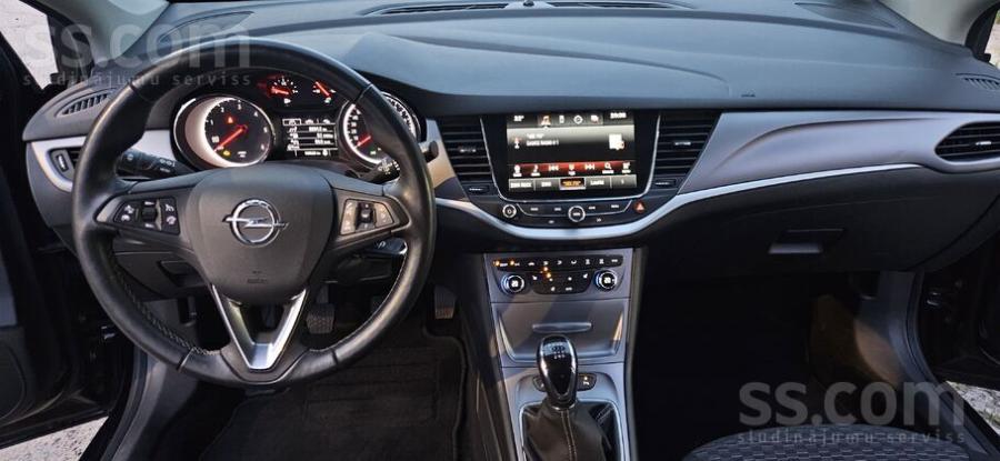 Black Opel Astra 2018 in Riga, with an engine capacity of 1.60 L and mileage of 139 thousand km for 7150 €, photo 9 on AUTOMOTO.COM.LV