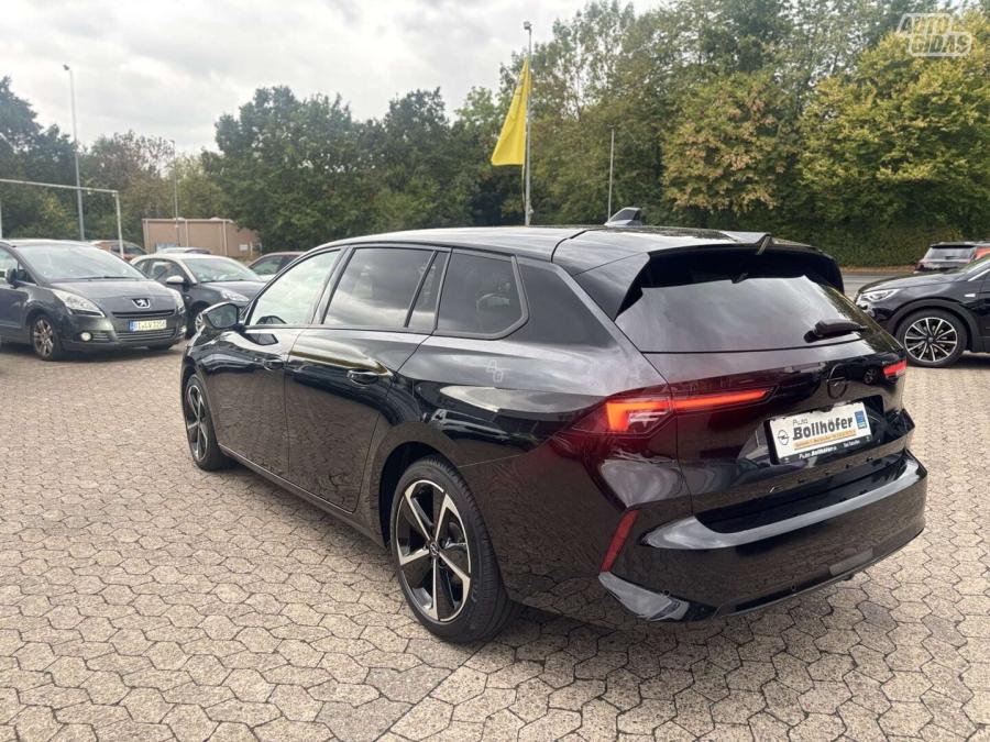 Black Opel Astra 2024 in Kaunas, with an engine capacity of 1.20 L and mileage of 21 thousand km for 24618 €, photo 3 on AUTOMOTO.COM.LV