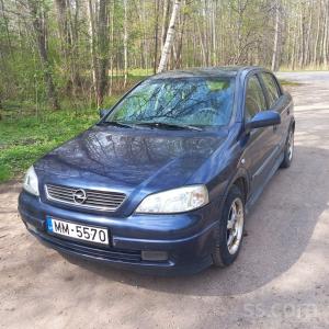 Zils Opel Astra 1999 Rīga, ar dzinēja tilpumu 1.80 L un nobraukumu 298 tūkst. km par 1000 €, foto  vietnē AUTOMOTO.COM.LV