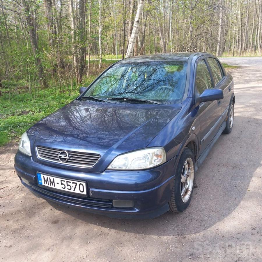 Zils Opel Astra 1999 Rīga, ar dzinēja tilpumu 1.80 L un nobraukumu 298 tūkst. km par 1000 €, foto 1 vietnē AUTOMOTO.COM.LV