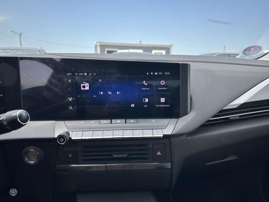 Blue Opel Astra 2023 in Vilnius, with an engine capacity of 1.20 L and mileage of 165 thousand km for 14156 €, photo 17 on AUTOMOTO.COM.LV