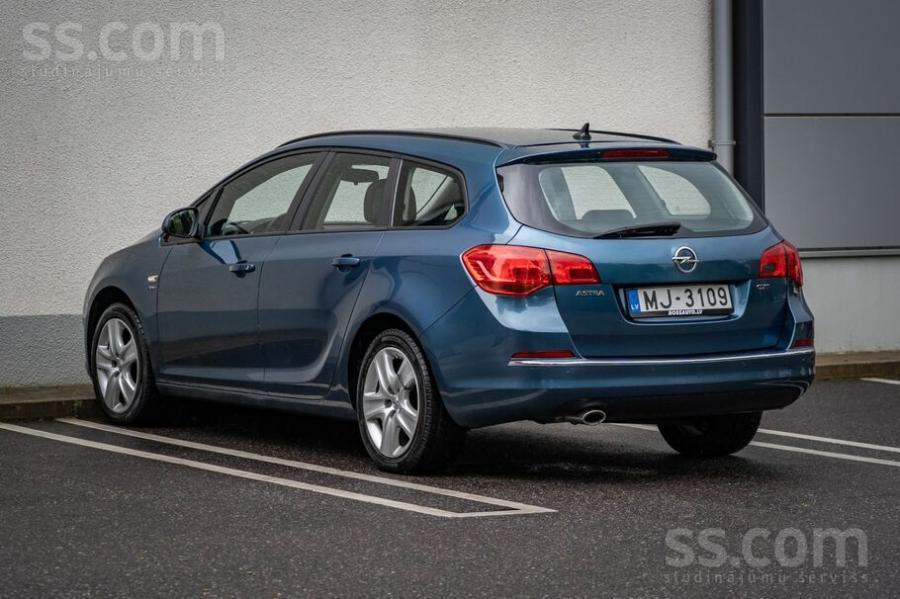 Blue Opel Astra 2013 in Riga, with an engine capacity of 2.00 L and mileage of 322 thousand km for 1650 €, photo 7 on AUTOMOTO.COM.LV