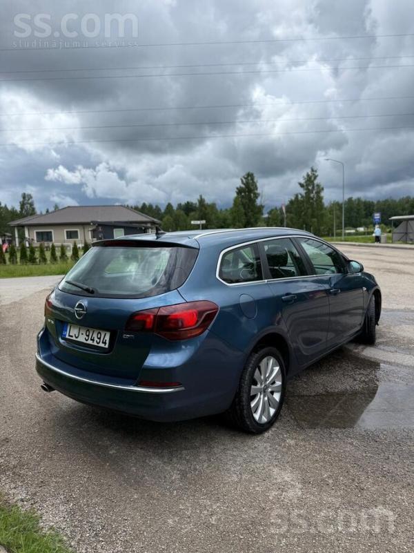 Zils Opel Astra 2014 Rīga, ar dzinēja tilpumu 2.00 L un nobraukumu 302 tūkst. km par 3900 €, foto 6 vietnē AUTOMOTO.COM.LV