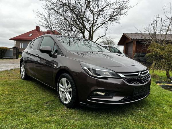 Brown Opel Astra 2018 in Ukmerge, with an engine capacity of 1.40 L and mileage of 128 thousand km for 6950 €, photo 1 on AUTOMOTO.COM.LV