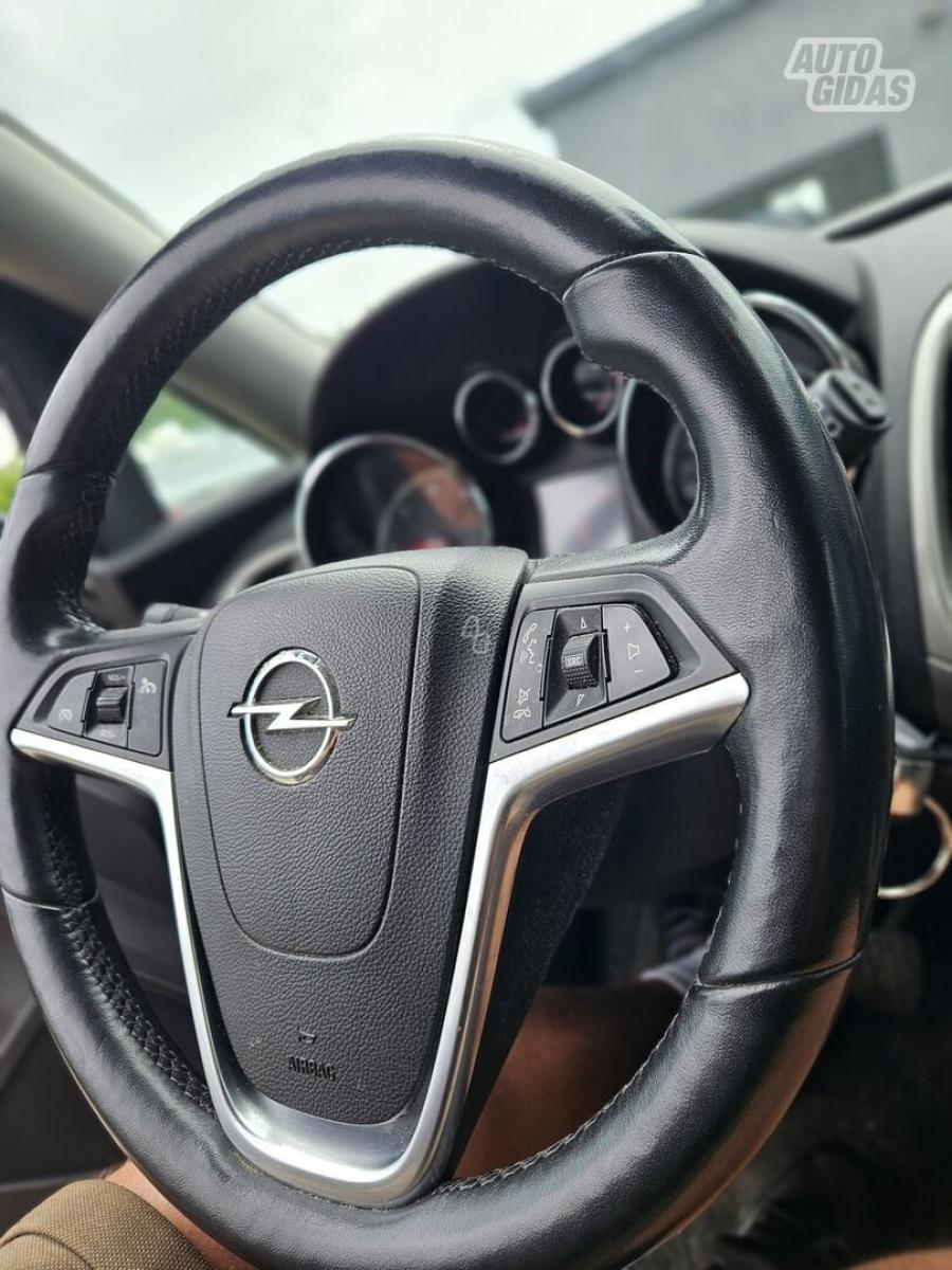 Brown Opel Astra 2012 in Kluonaliai, with an engine capacity of 1.70 L and mileage of 279 thousand km for 2499 €, photo 14 on AUTOMOTO.COM.LV