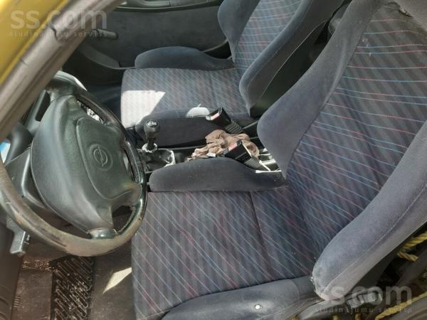 Green Opel Astra 1996 in Ogre, with an engine capacity of 1.40 L and mileage of 359 thousand km for 450 €, photo 8 on AUTOMOTO.COM.LV