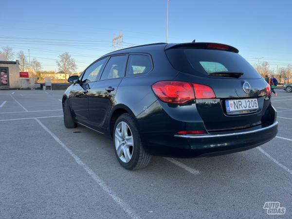 Green Opel Astra 2014 in Siauliai, with an engine capacity of 1.40 L and mileage of 206 thousand km for 5500 €, photo 7 on AUTOMOTO.COM.LV