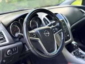 Grey Opel Astra 2012 in Utena, with an engine capacity of 1.69 L and mileage of 332 thousand km for 1750 €, photo 26 on AUTOMOTO.COM.LV