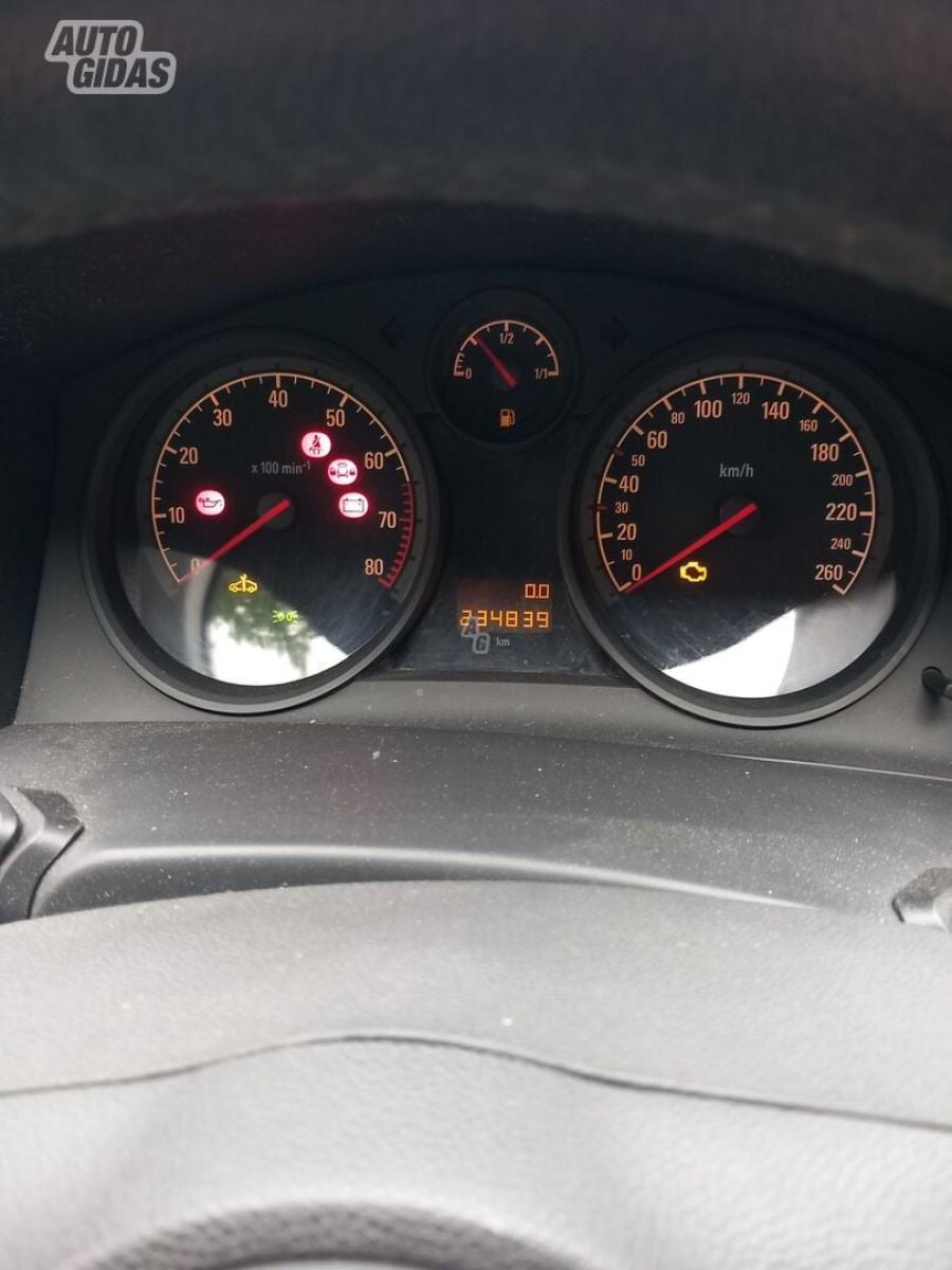 Grey Opel Astra 2012 in Silute, with an engine capacity of 1.60 L and mileage of 234 thousand km for 950 €, photo 13 on AUTOMOTO.COM.LV