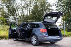Grey Opel Astra 2011 in Riga, with an engine capacity of 1.70 L and mileage of 299 thousand km for 4290 €, photo 10 on AUTOMOTO.COM.LV
