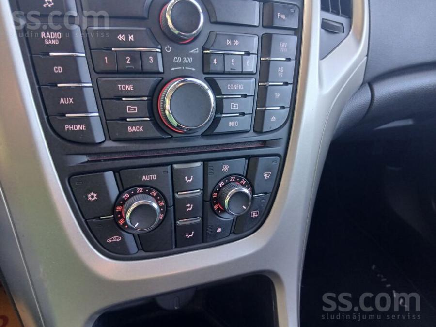 Grey Opel Astra 2012 in Riga, with an engine capacity of 1.40 L and mileage of 220 thousand km for 4000 €, photo 14 on AUTOMOTO.COM.LV