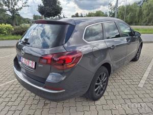 Grey Opel Astra 2014 in Saldus, with an engine capacity of 2.00 L and mileage of 260 thousand km for 4990 €, photo 6 on AUTOMOTO.COM.LV