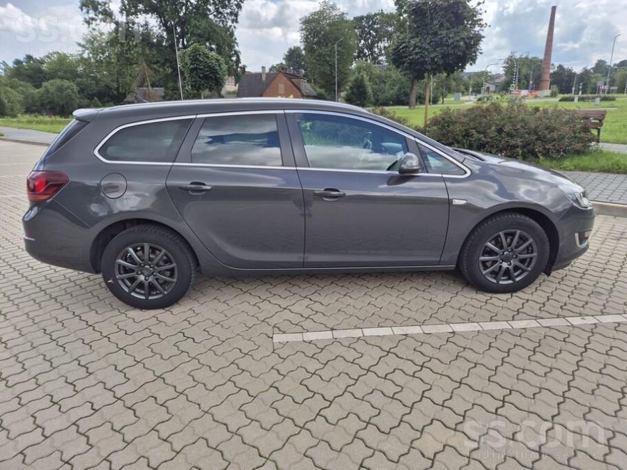 Grey Opel Astra 2014 in Saldus, with an engine capacity of 2.00 L and mileage of 260 thousand km for 4990 €, photo 7 on AUTOMOTO.COM.LV