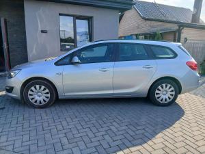 Grey Opel Astra 2014 in Kaunas, with an engine capacity of 1.69 L and mileage of 228 thousand km for 2949 €, photo 6 on AUTOMOTO.COM.LV