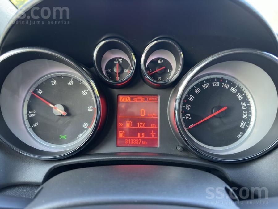 Grey Opel Astra 2014 in Riga, with an engine capacity of 1.70 L and mileage of 313 thousand km for 3300 €, photo 18 on AUTOMOTO.COM.LV