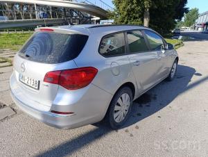 Grey Opel Astra 2015 in Riga, with an engine capacity of 1.60 L and mileage of 240 thousand km for 3300 €, photo 6 on AUTOMOTO.COM.LV