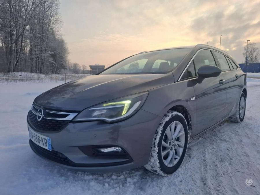 Grey Opel Astra 2016 in Kaunas, with an engine capacity of 1.60 L and mileage of 263 thousand km for 6250 €, photo 1 on AUTOMOTO.COM.LV