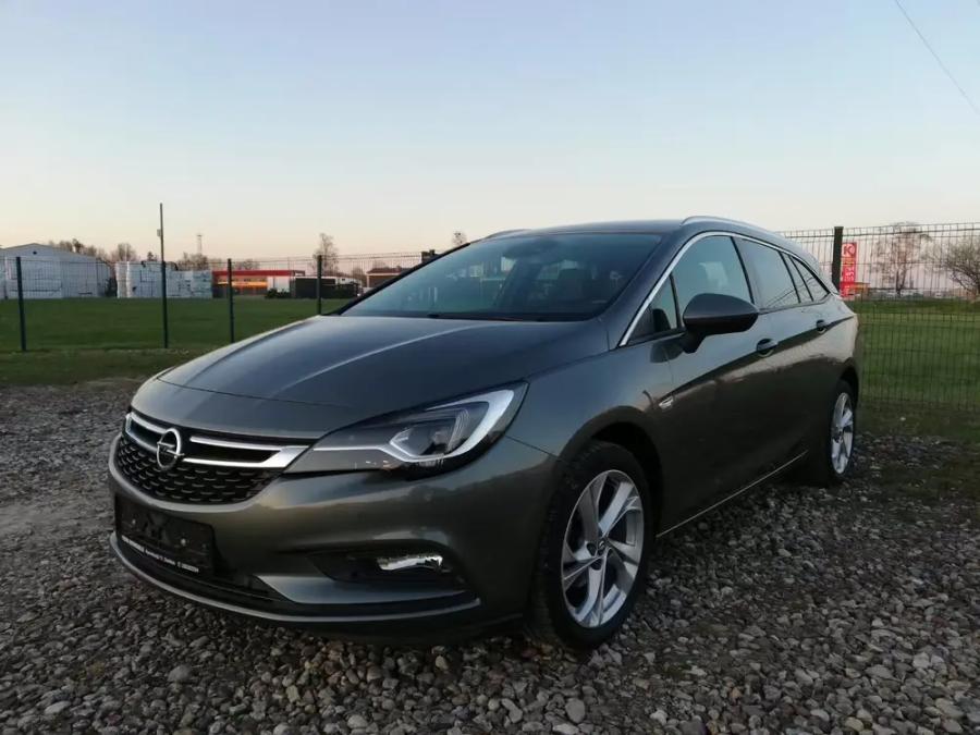 Grey Opel Astra 2016 in Saldus, with an engine capacity of 1.40 L and mileage of 149 thousand km for 9700 €, photo 1 on AUTOMOTO.COM.LV