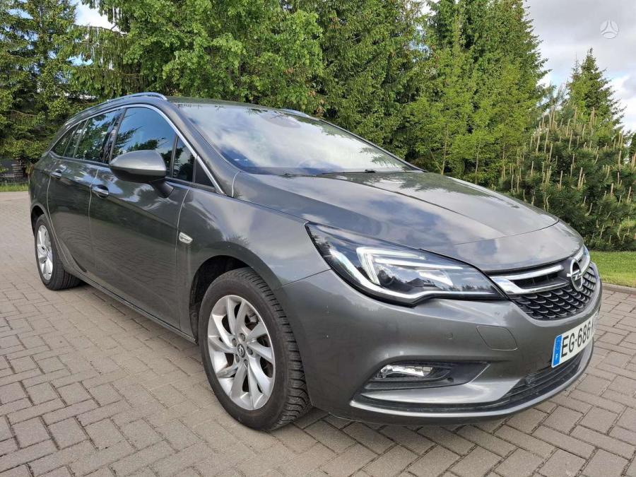 Grey Opel Astra 2016 in Kaunas, with an engine capacity of 1.60 L and mileage of 249 thousand km for 4900 €, photo 1 on AUTOMOTO.COM.LV