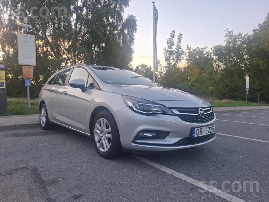 Grey Opel Astra 2018 in Riga, with an engine capacity of 1.60 L and mileage of 202 thousand km for 5600 €, photo 1 on AUTOMOTO.COM.LV
