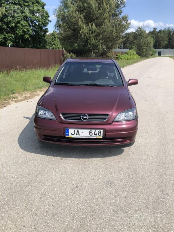 Red Opel Astra 2004 in Riga, with an engine capacity of 1.60 L and mileage of 236 thousand km for 1550 €, photo 2 on AUTOMOTO.COM.LV
