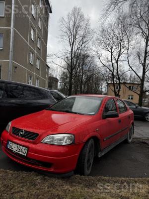 Sarkans Opel Astra 2003 Rīga, ar dzinēja tilpumu 2.00 L un nobraukumu 300 tūkst. km par 300 €, foto  vietnē AUTOMOTO.COM.LV