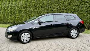 Red Opel Astra 2011 in Riga, with an engine capacity of 1.30 L and mileage of 358 thousand km for 1890 €, photo 5 on AUTOMOTO.COM.LV