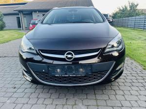Red Opel Astra 2014 in Marijampole, with an engine capacity of 1.96 L and mileage of 169 thousand km for 4450 €, photo 7 on AUTOMOTO.COM.LV