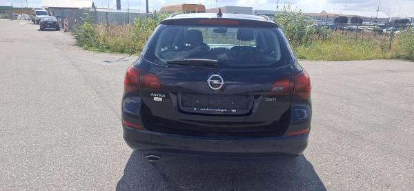 Violet Opel Astra 2011 in Marijampole, with an engine capacity of 1.96 L and mileage of 289 thousand km for 3300 €, photo 8 on AUTOMOTO.COM.LV
