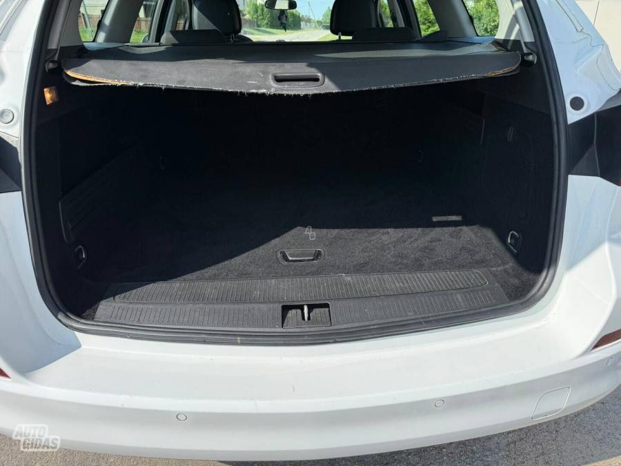 White Opel Astra 2011 in Alytus, with an engine capacity of 1.40 L and mileage of 180 thousand km for 2599 €, photo 14 on AUTOMOTO.COM.LV