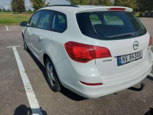 White Opel Astra 2012 in Ukmerge, with an engine capacity of 1.30 L and mileage of 154 thousand km for 1750 €, photo 6 on AUTOMOTO.COM.LV