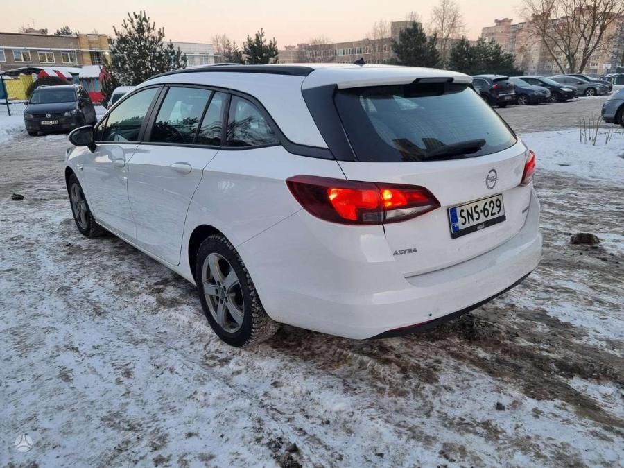 White Opel Astra 2016 in Kaunas, with an engine capacity of 1.00 L and mileage of 207 thousand km for 5850 €, photo 3 on AUTOMOTO.COM.LV