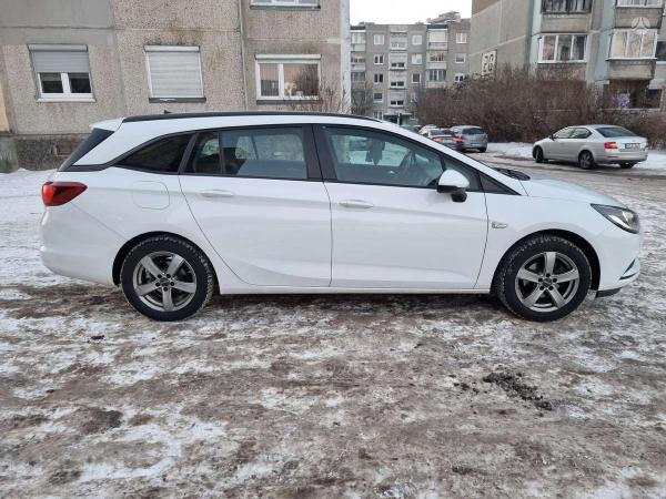 White Opel Astra 2016 in Kaunas, with an engine capacity of 1.00 L and mileage of 207 thousand km for 5850 €, photo 6 on AUTOMOTO.COM.LV