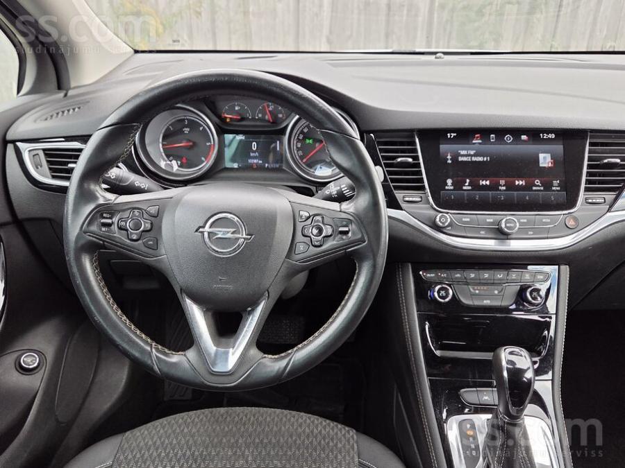 White Opel Astra 2017 in Riga, with an engine capacity of 1.60 L and mileage of 172 thousand km for 5790 €, photo 10 on AUTOMOTO.COM.LV
