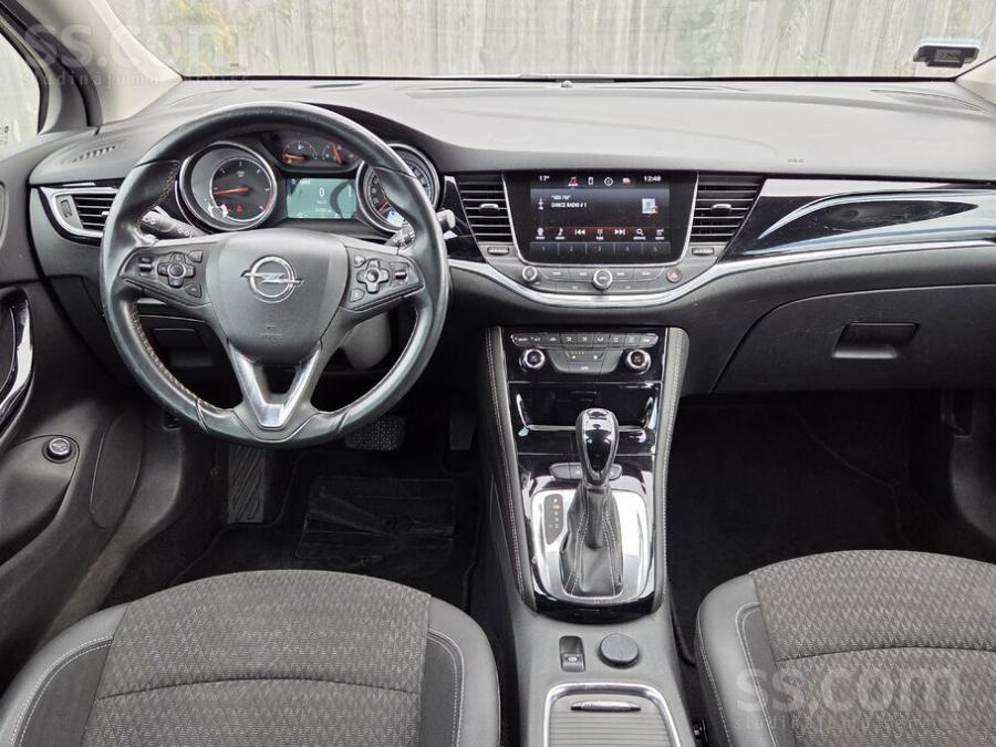 White Opel Astra 2017 in Riga, with an engine capacity of 1.60 L and mileage of 172 thousand km for 5790 €, photo 13 on AUTOMOTO.COM.LV