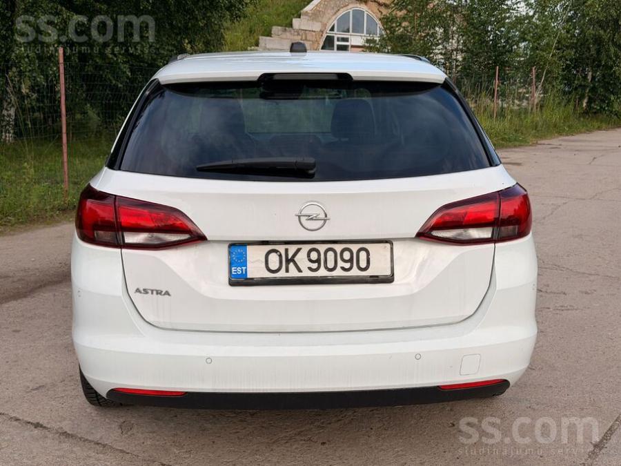 White Opel Astra 2021 in Riga, with an engine capacity of 1.60 L and mileage of 181 thousand km for 6950 €, photo 9 on AUTOMOTO.COM.LV