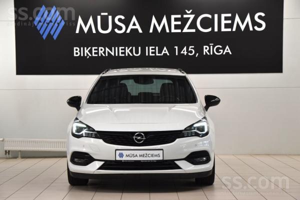 White Opel Astra 2021 in Riga, with an engine capacity of 1.20 L and mileage of 73 thousand km for 11390 €, photo 2 on AUTOMOTO.COM.LV