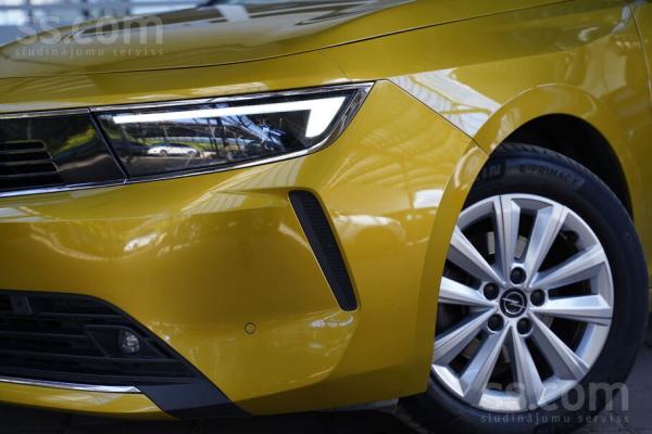 Yellow Opel Astra 2023 in Riga, with an engine capacity of 1.20 L and mileage of 61 thousand km for 12990 €, photo 3 on AUTOMOTO.COM.LV