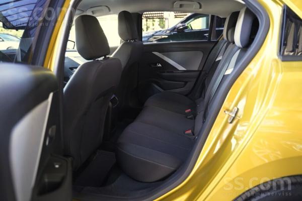 Yellow Opel Astra 2023 in Riga, with an engine capacity of 1.20 L and mileage of 61 thousand km for 12990 €, photo 10 on AUTOMOTO.COM.LV