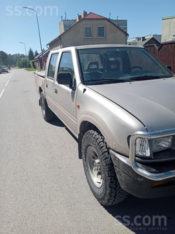 Pelēks Opel Campo 1998 Liepāja, ar dzinēja tilpumu 2.50 L un nobraukumu 326 tūkst. km par 990 €, foto 4 vietnē AUTOMOTO.COM.LV