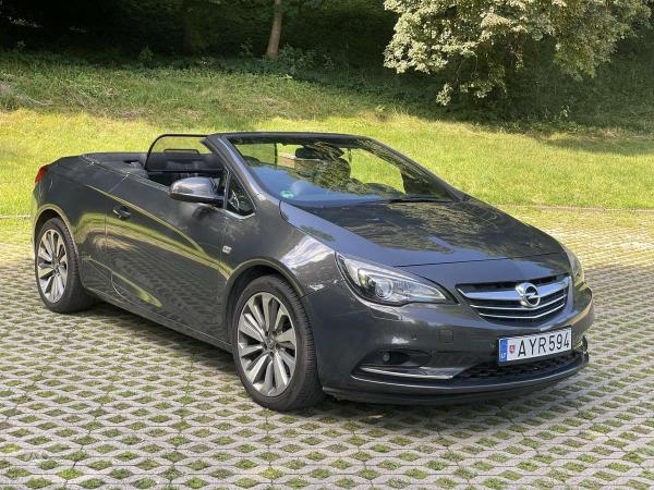 Brown Opel Cascada 2013 in Vilnius, with an engine capacity of 1.96 L and mileage of 159 thousand km for 7400 €, photo 1 on AUTOMOTO.COM.LV