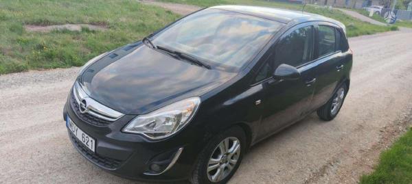 Black Opel Corsa 2013 in Vilnius, with an engine capacity of 1.23 L and mileage of 124 thousand km for 2350 €, photo 2 on AUTOMOTO.COM.LV