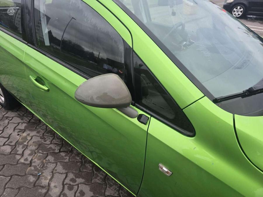Green Opel Corsa 2015 in Kaunas, with an engine capacity of 1.25 L and mileage of 166 thousand km for 4100 €, photo 9 on AUTOMOTO.COM.LV